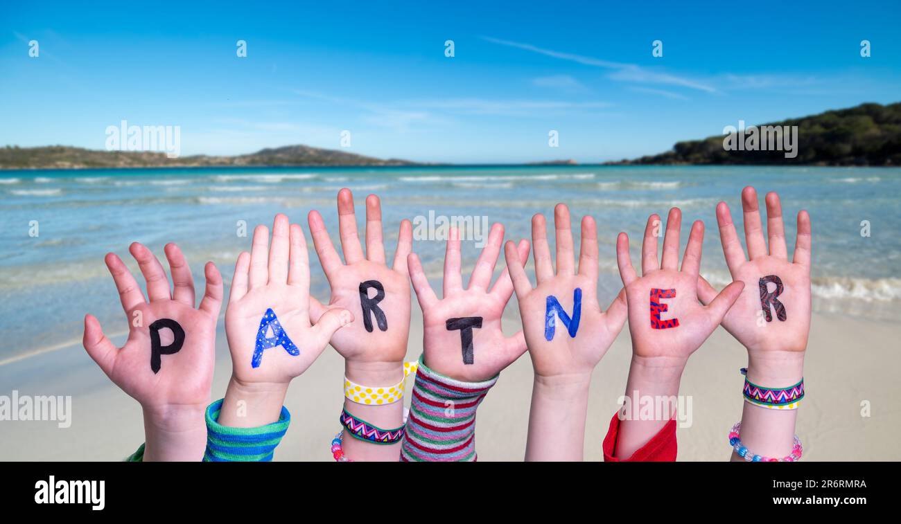 Children Hands Building Word Partner, Sea And Ocean Background Stock ...