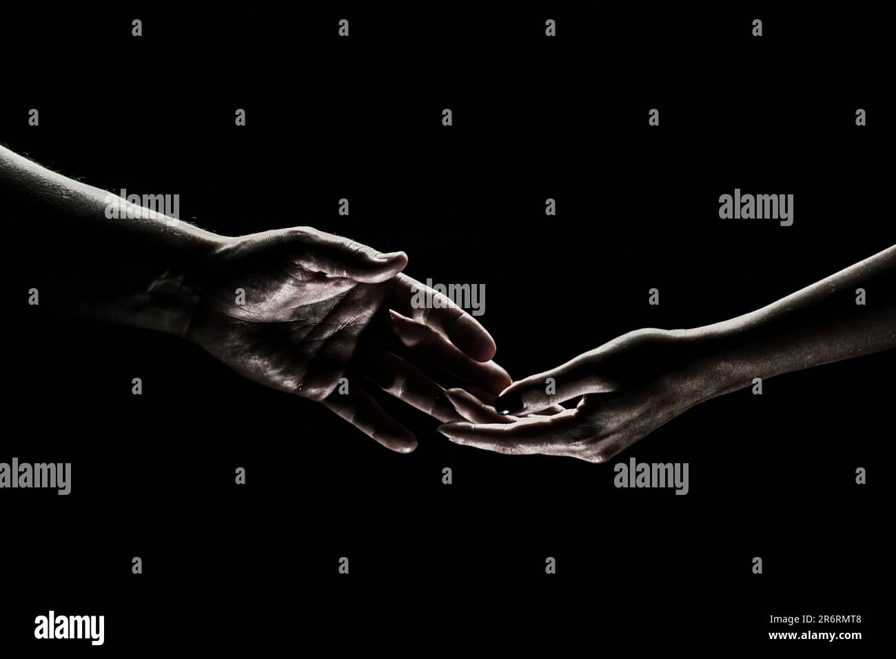 Two hands reaching toward. Helping hand outstretched for salvation on ...
