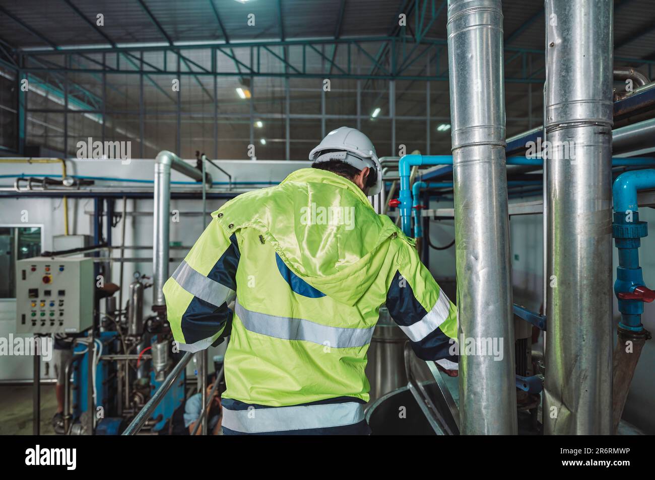 Commitment caucasian technician engineer man in safety uniform standing ...
