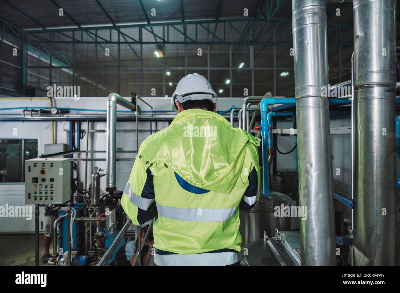 Commitment caucasian technician engineer man in safety uniform standing ...
