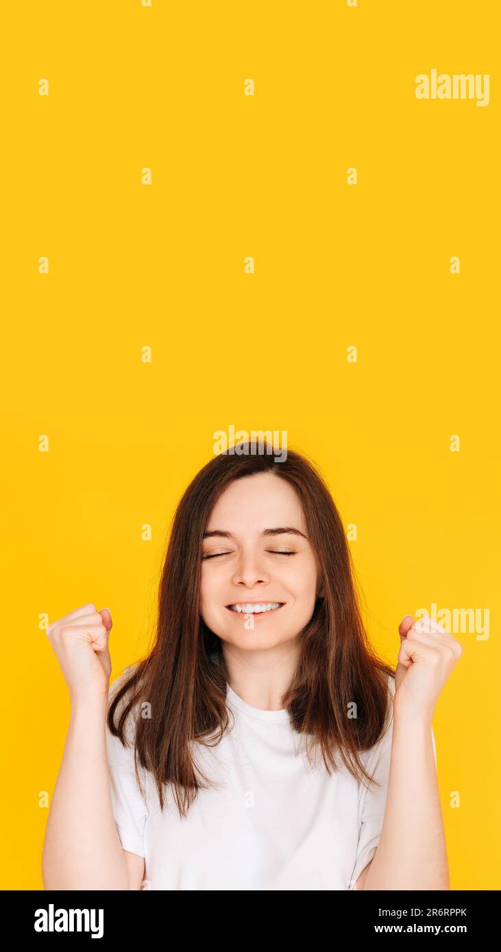 Exhilarated Woman Celebrating Big Win with Raised Fists - Excitement ...