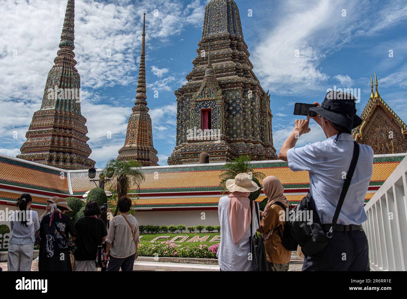 A tourist takes photos at Wat Pho in Bangkok. (Photo by Peerapon Boonyakiat / SOPA Image/Sipa ...