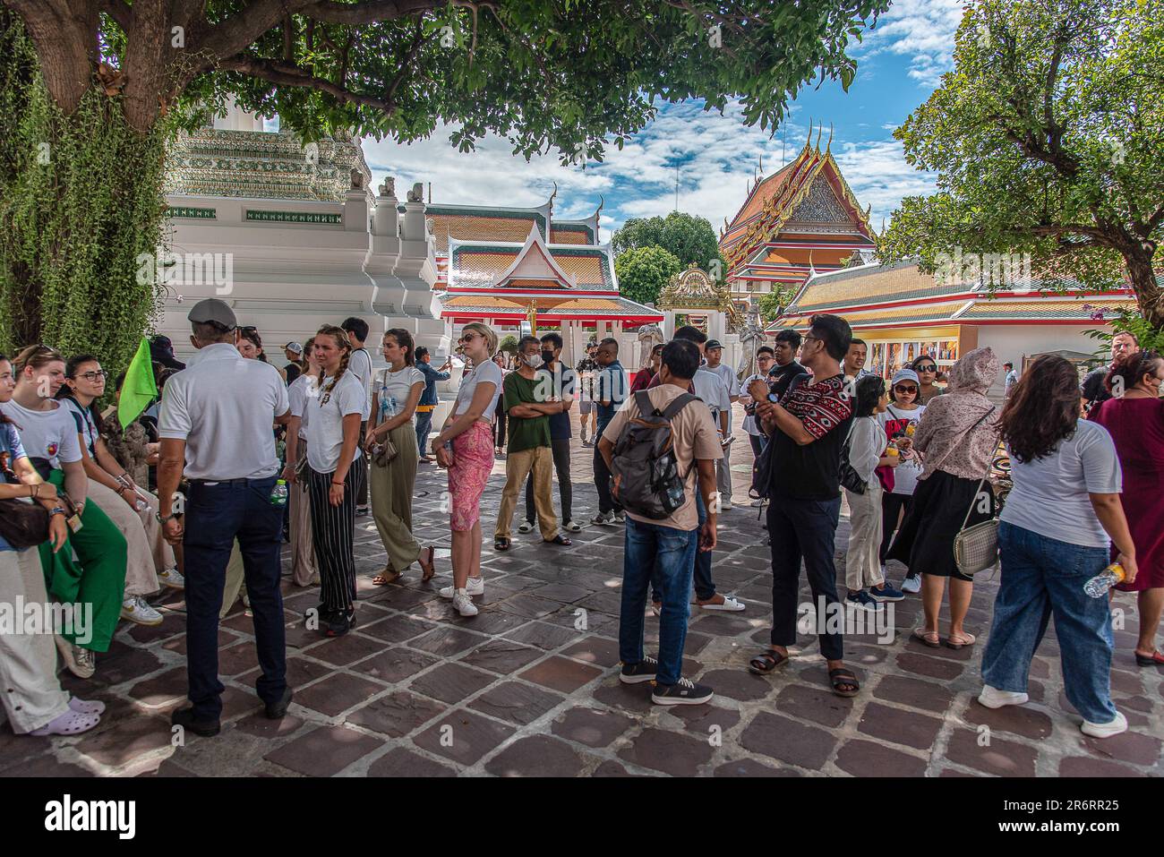 Tourists visit the Wat Pho in Bangkok. (Photo by Peerapon Boonyakiat / SOPA Image/Sipa USA Stock ...