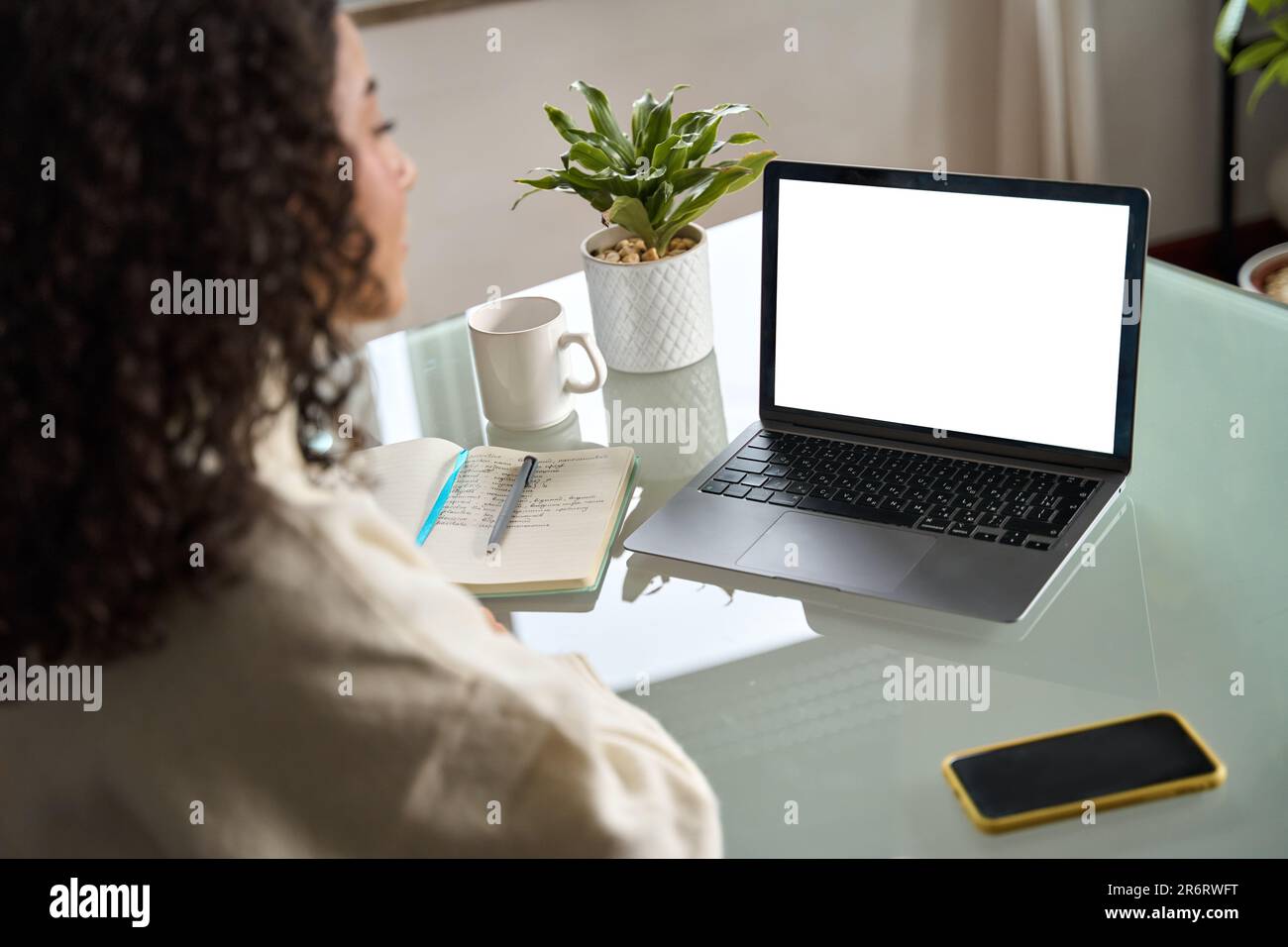 Over shoulder view of girl elearning looking at mock up pc laptop ...