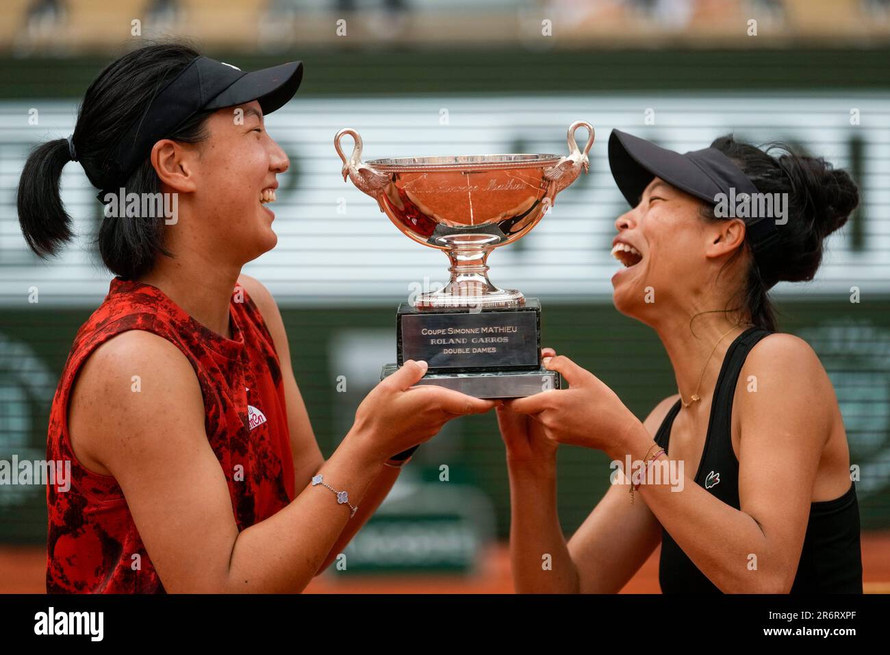 China's Wang Xinyu, left, and Hsieh Su-Wei of Taiwan lift the trophy as ...