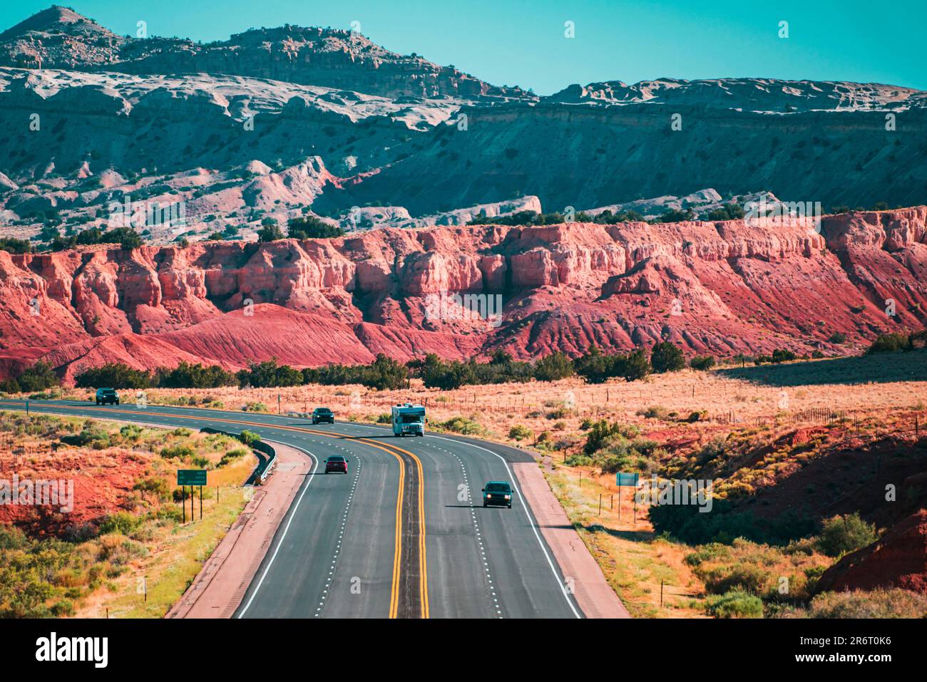 Asphalt highway and hill landscape under the blue sky. Curved Arizona ...