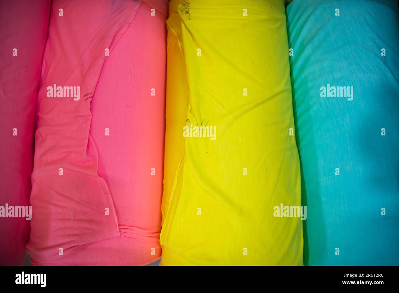 Artistic variety of shade tone colors Textile Fabrics rolls stacked ...