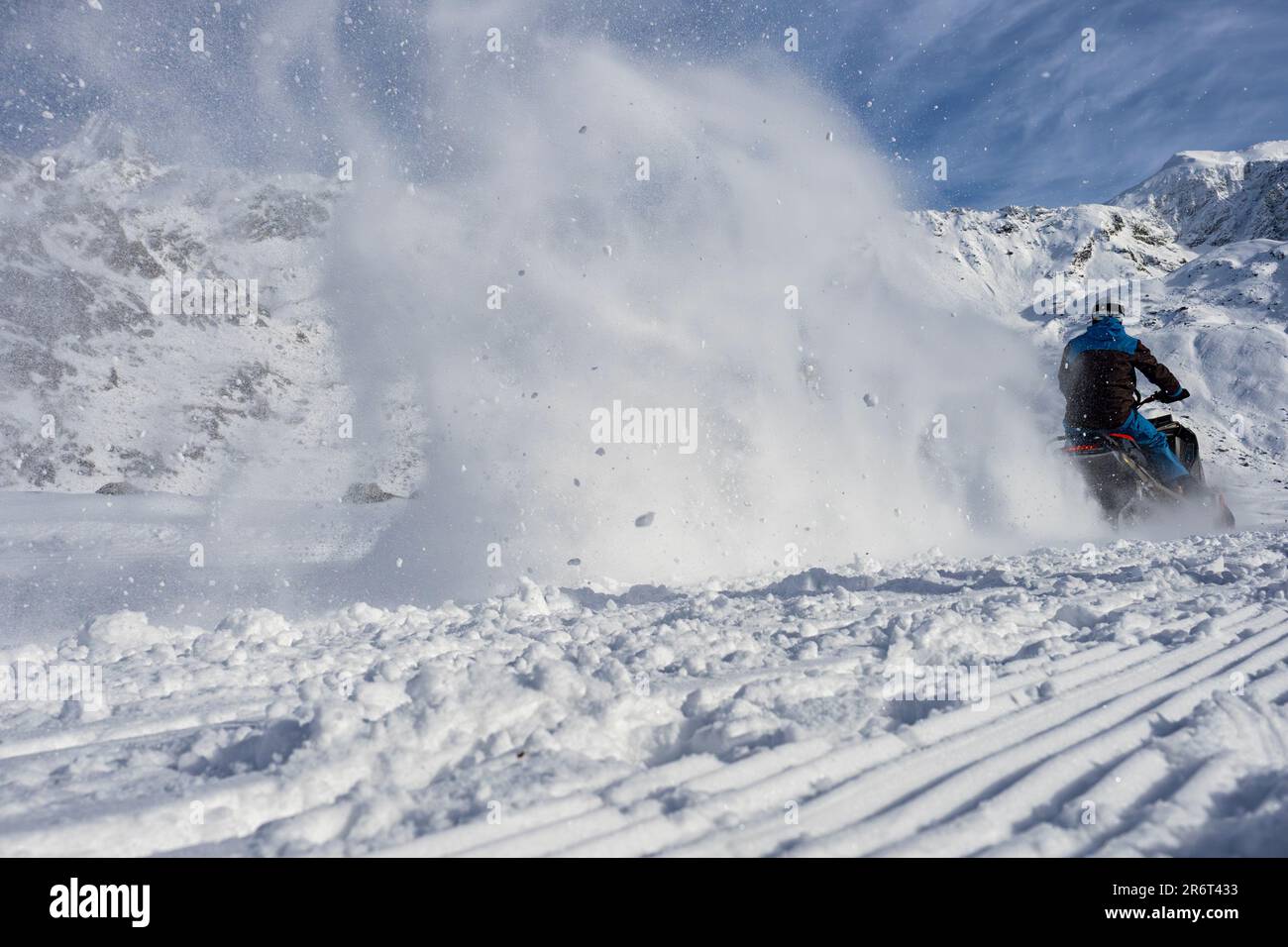 Snowmobile on a trail in the Italian alps Stock Photo - Alamy