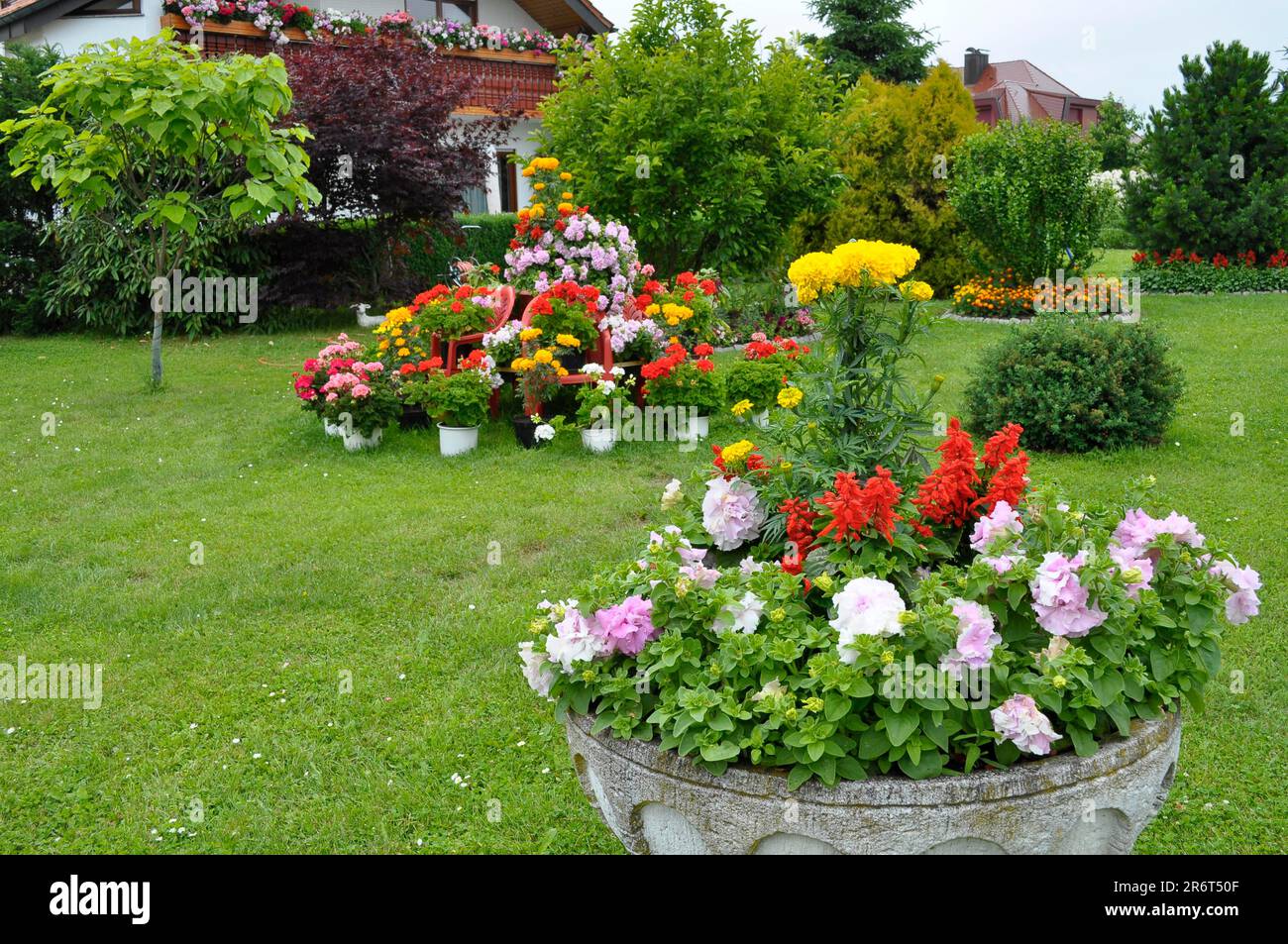 Flower pyramid in the garden, flower pot with flowers, lawn Stock Photo ...