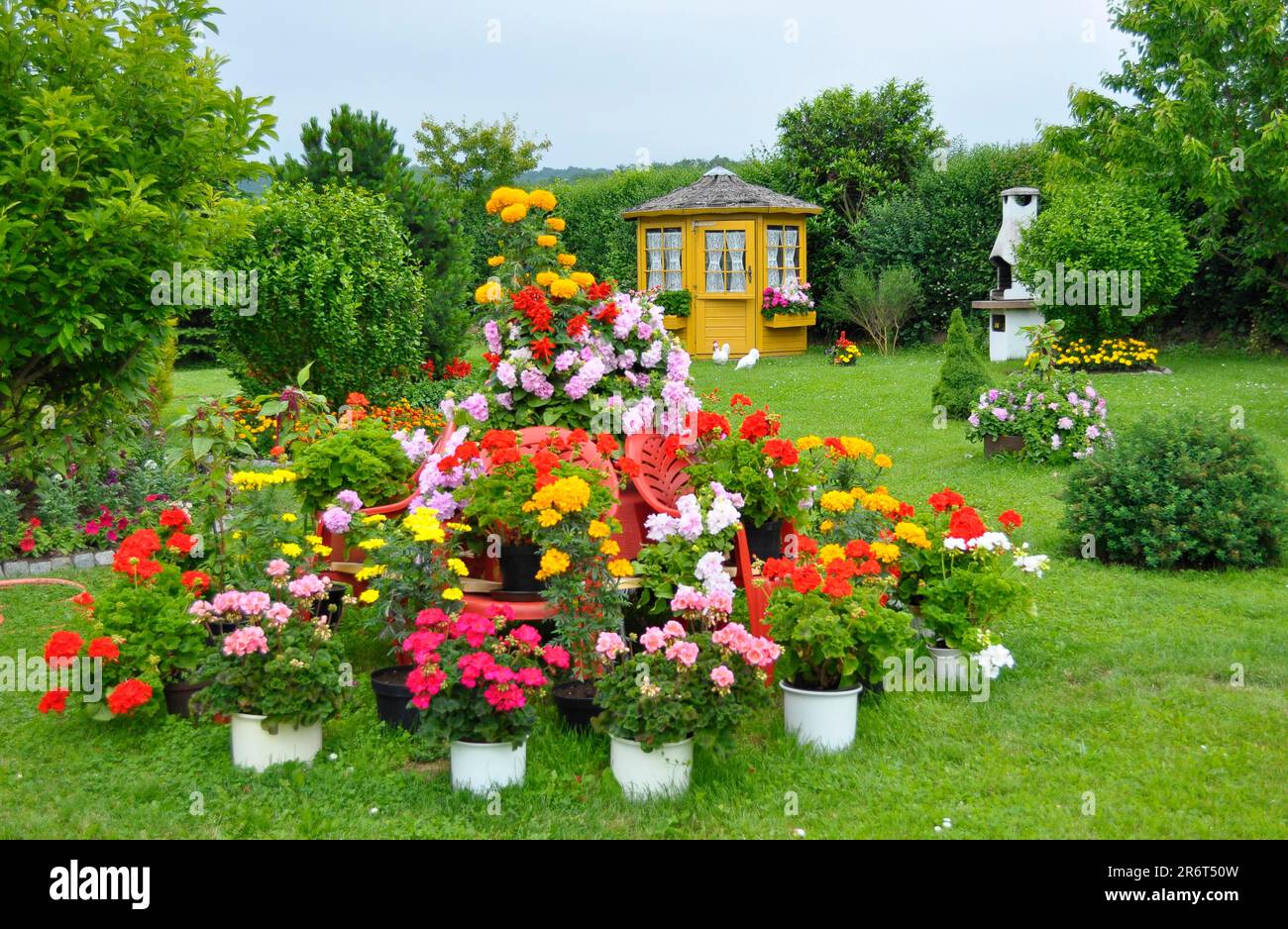 Pyramid of flowers in the garden, gazebo in the garden Stock Photo - Alamy