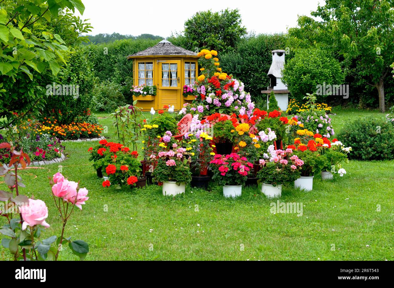 Pyramid of flowers in the garden, gazebo in the garden Stock Photo - Alamy