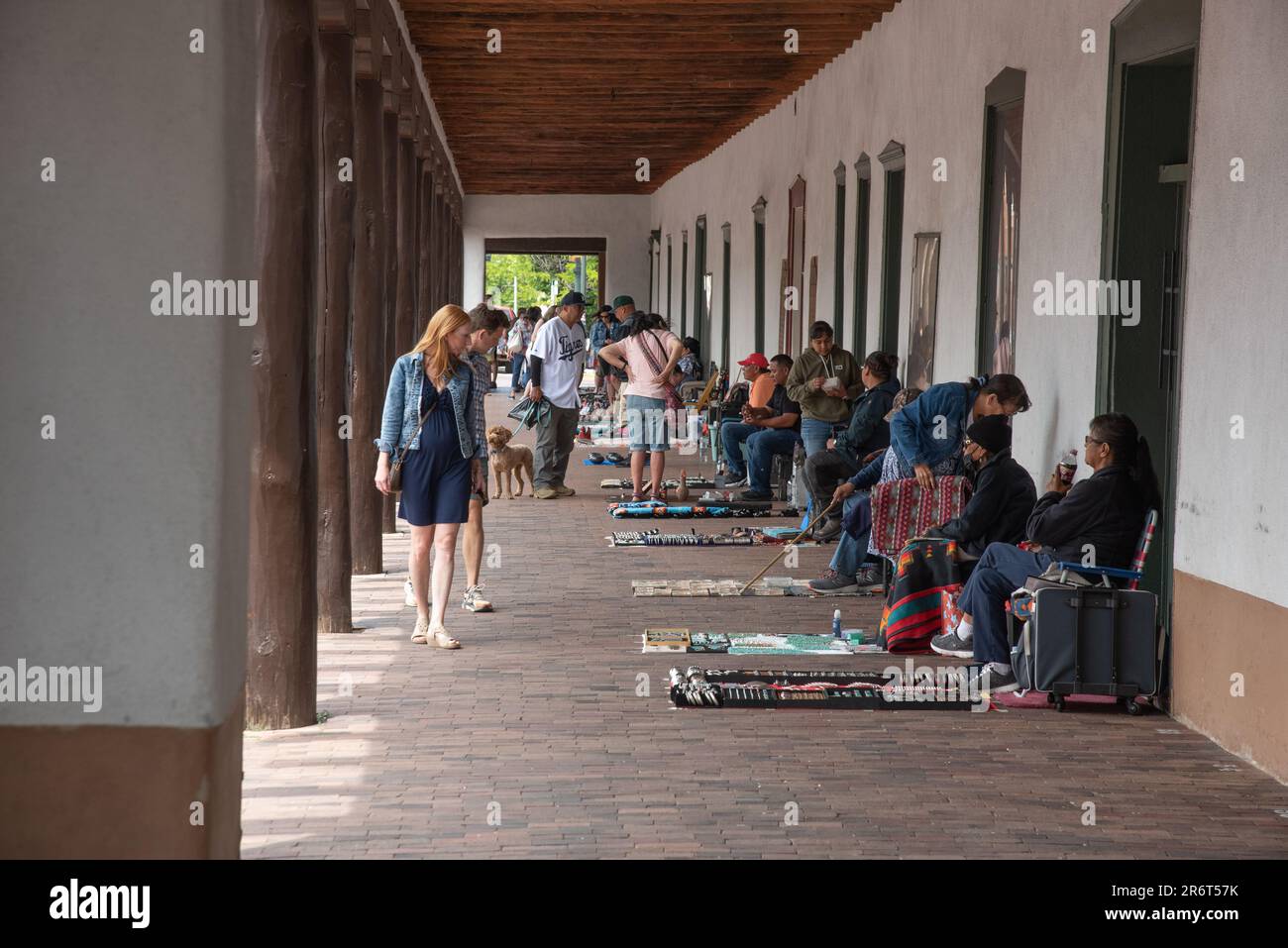 Shoppers walk down the line of Native American vendors at the historic ...