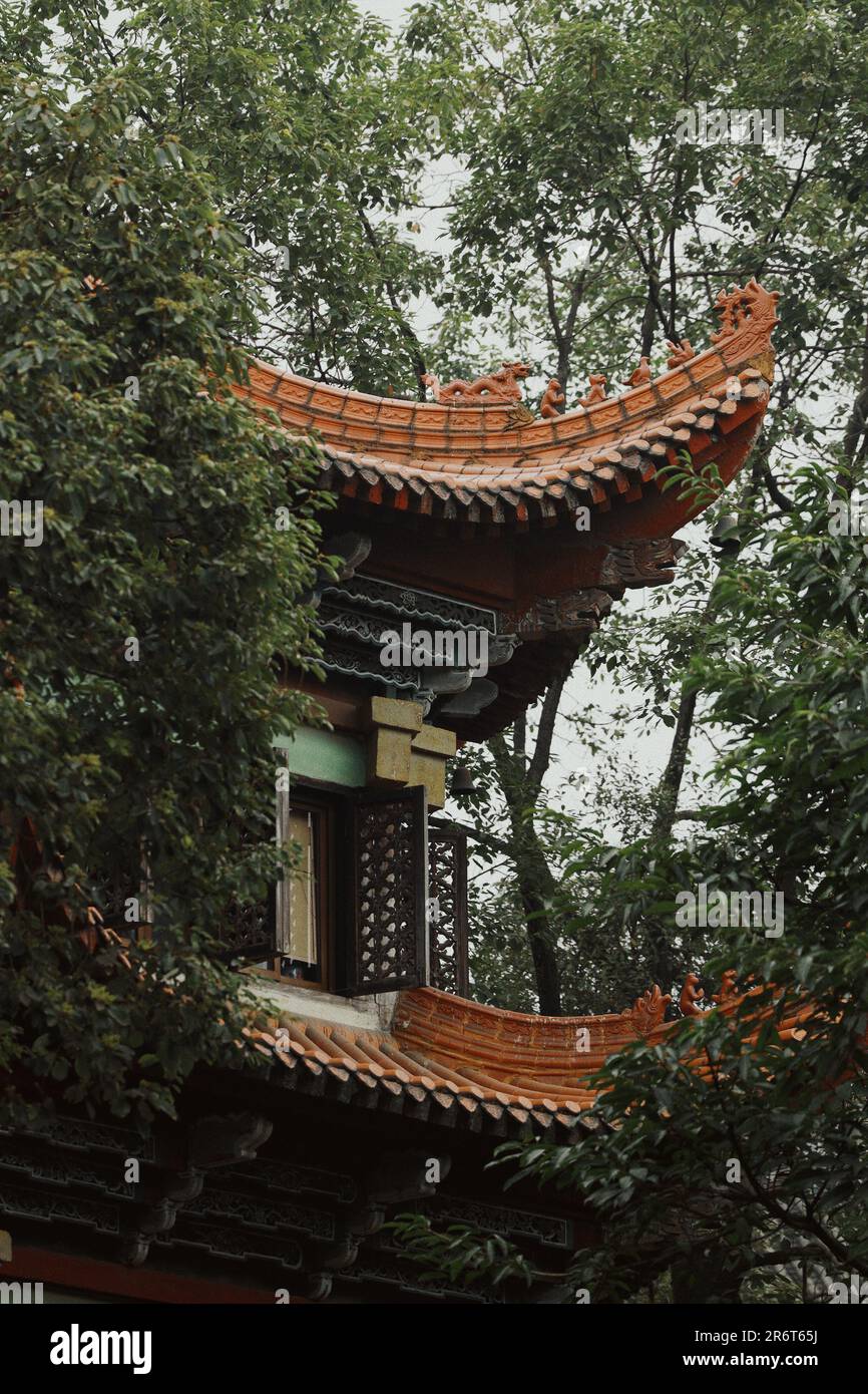 An Asian-style building featuring an exterior of bright orange tiled ...