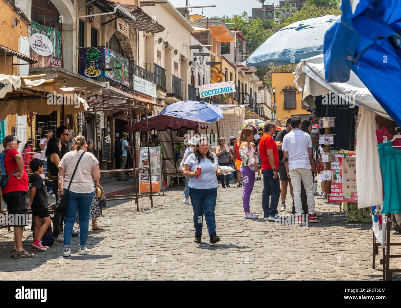 People walking past stalls in street market, Tepoztlán, State of ...
