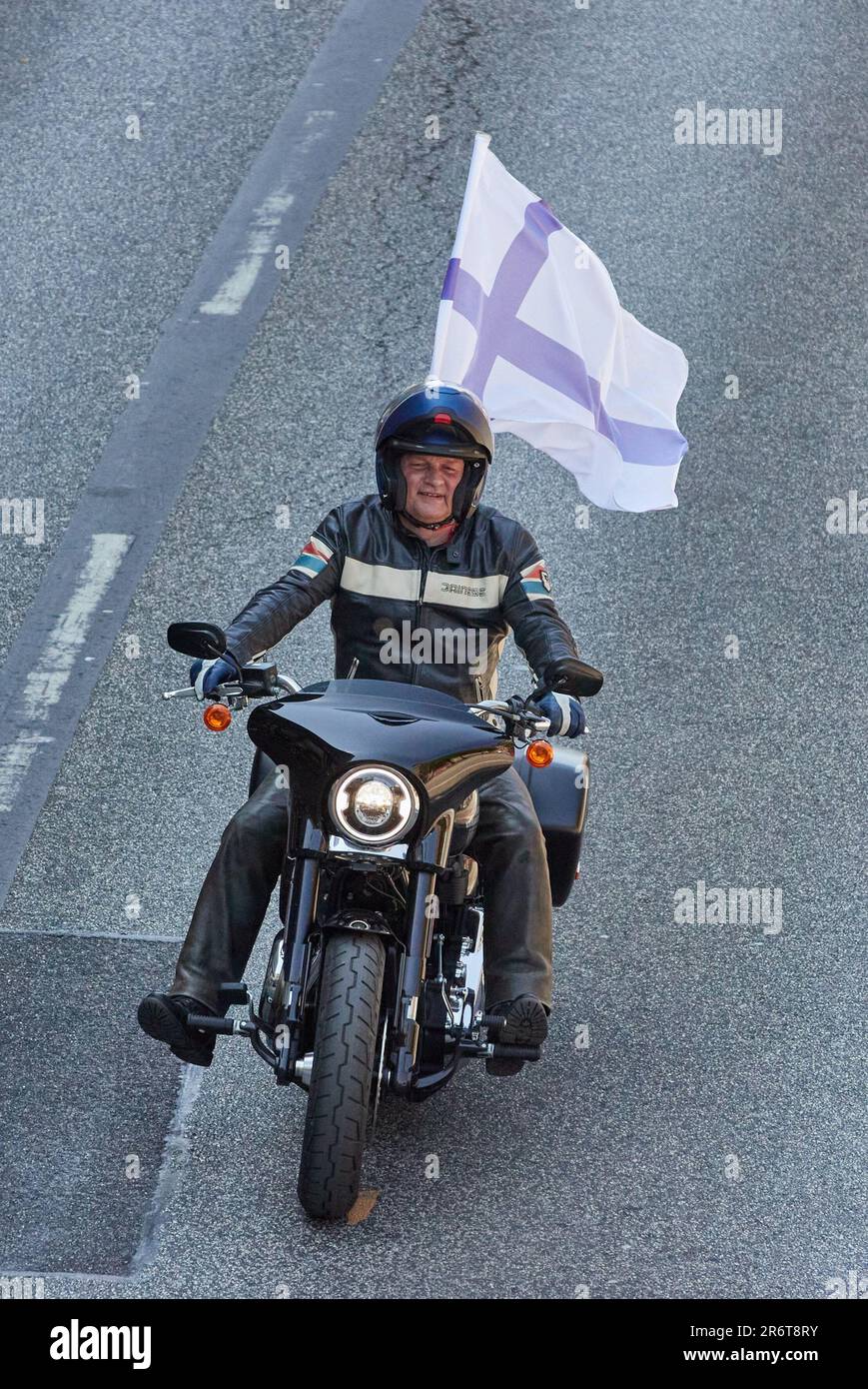 11 June 2023, Hamburg: Pastor Lars Lemke rides his motorcycle on Ludwig ...