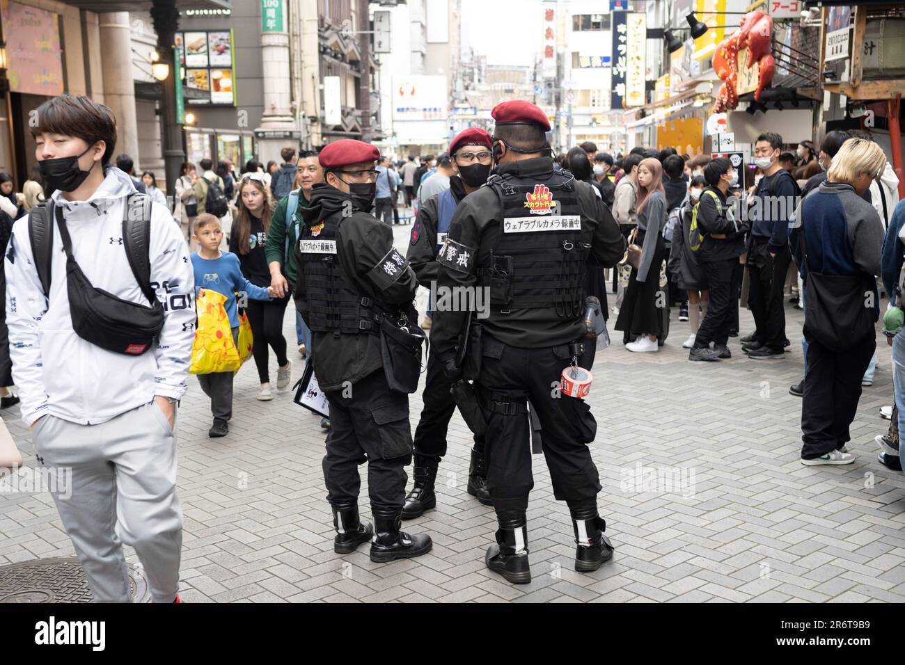 March 17, 2023, Osaka, Japan: Private security guards in black uniforms ...
