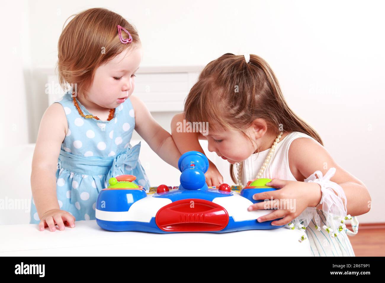 Adorable kids playing playing together Stock Photo - Alamy