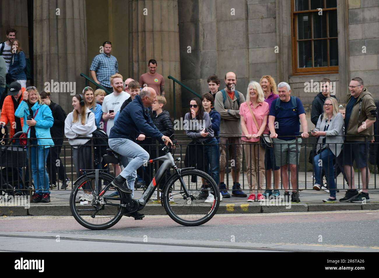Edinburgh Scotland, UK 11 June 2023. A cyclist gets a cheer as the ...