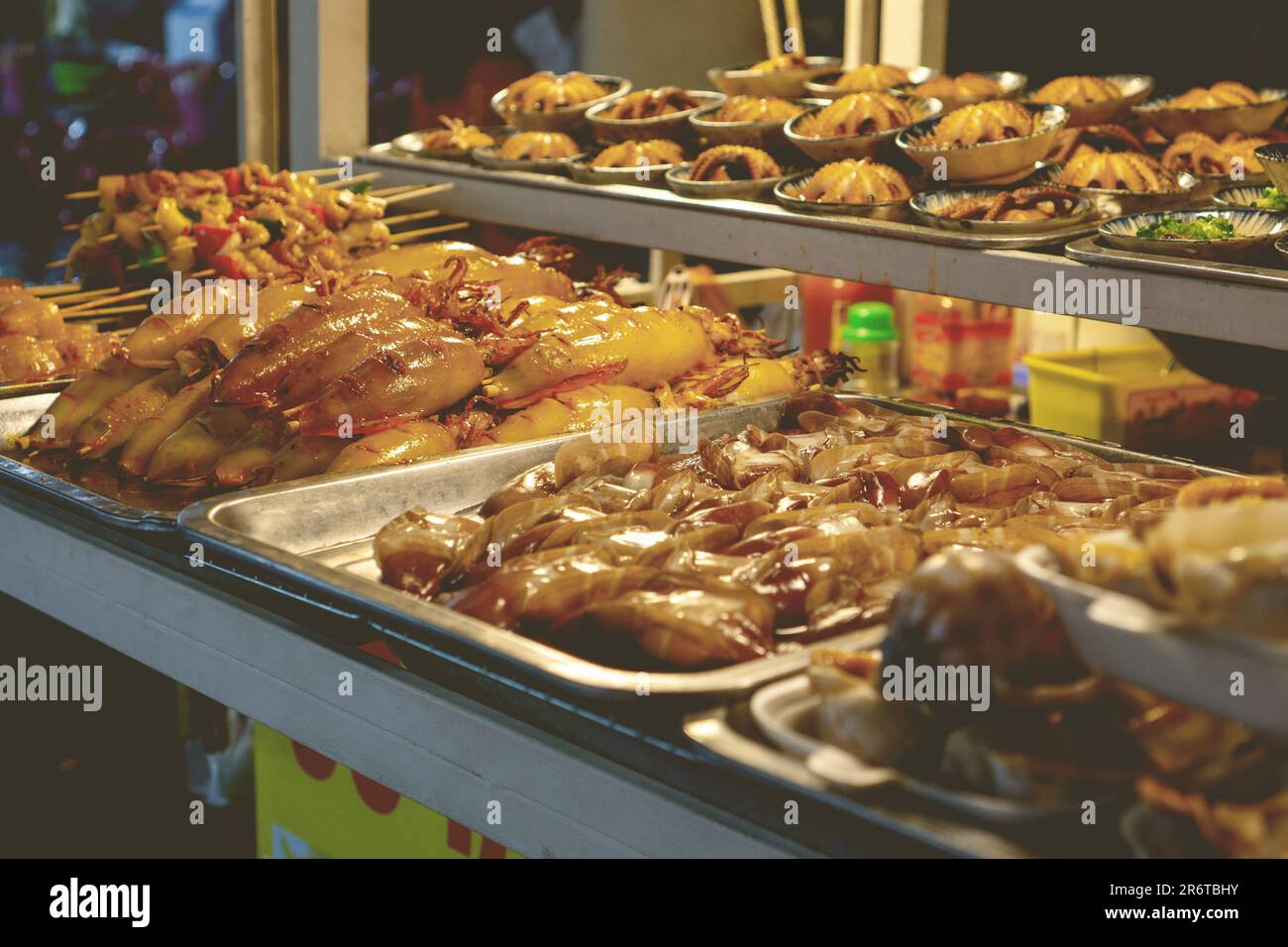 An outdoor food cart at a busy night market in an urban setting Stock ...