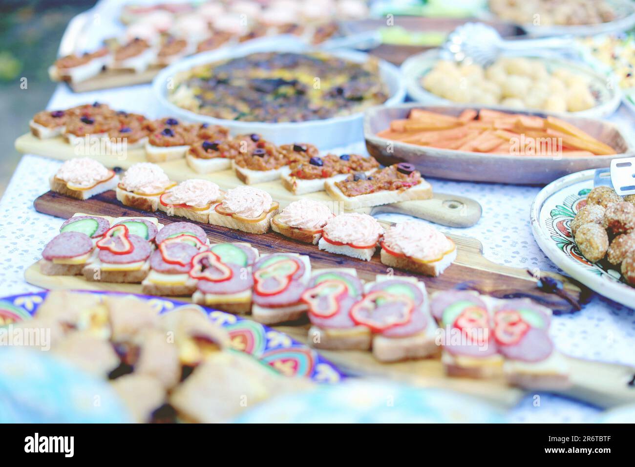 A white table with an array of food dishes displayed on the top Stock ...
