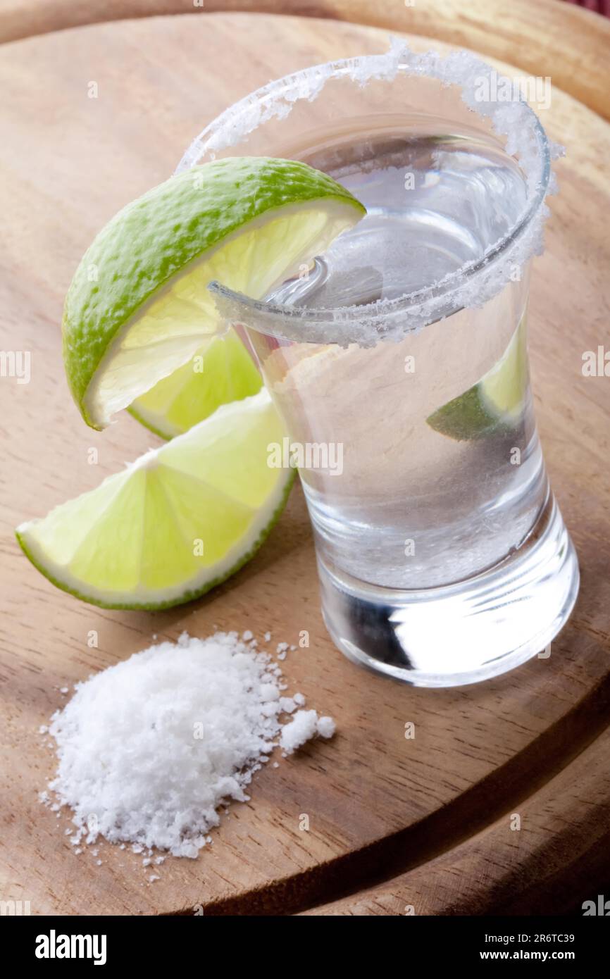 shot glass filled with clear cold alcohol Stock Photo - Alamy