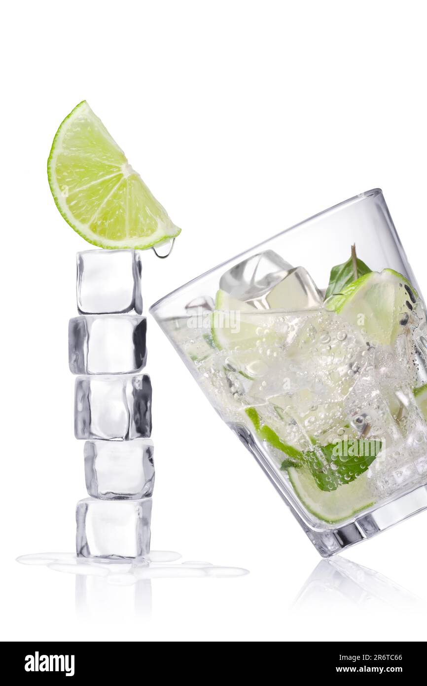 Cold fresh lemonade. Ice cubes and glass on a white background and with soft shadow Stock Photo ...