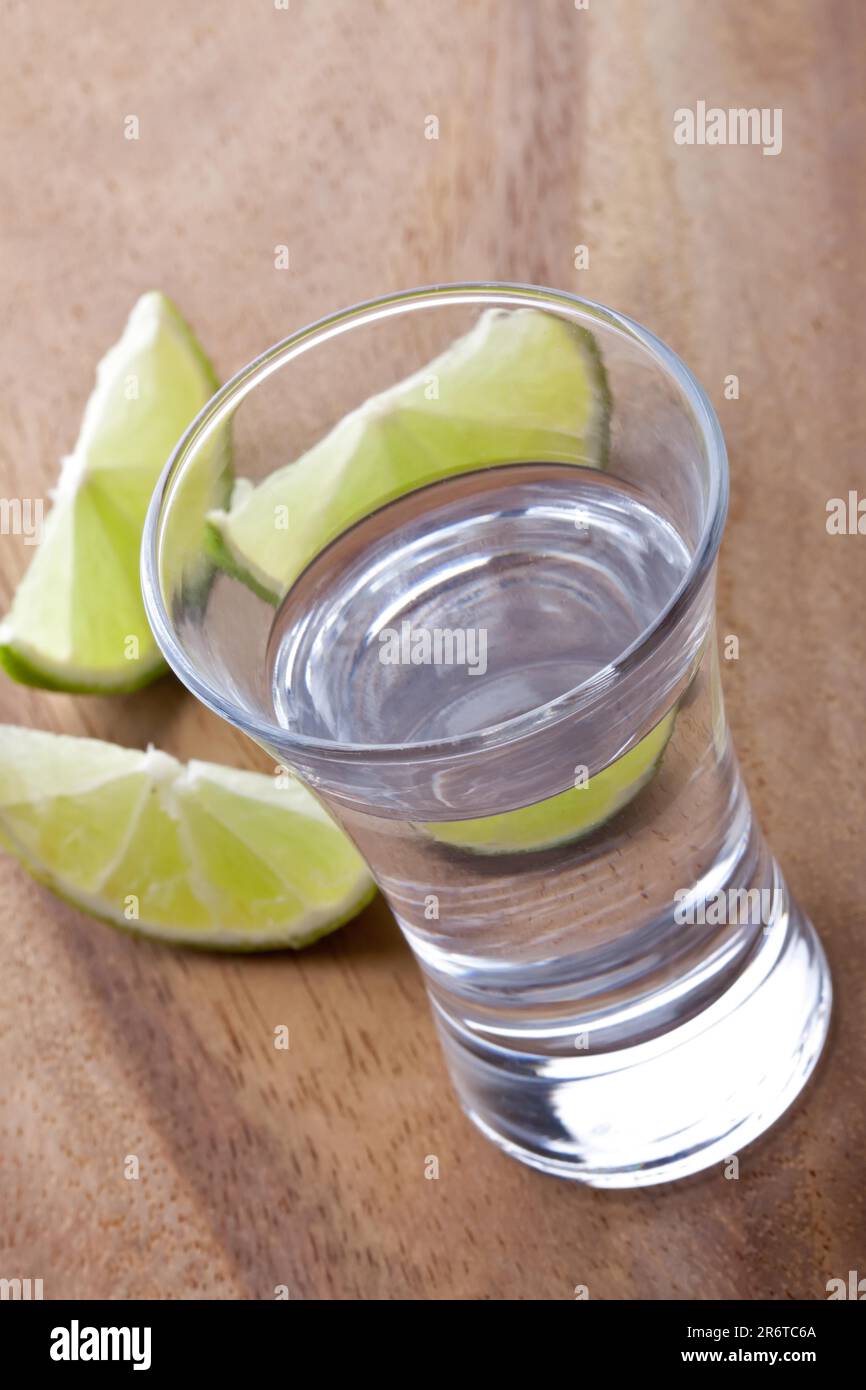 shot glass filled with clear cold alcohol Stock Photo - Alamy