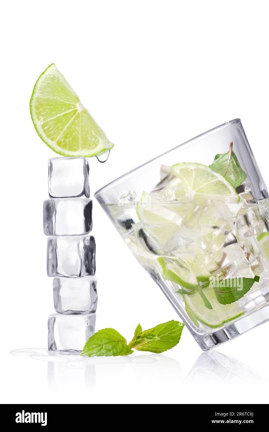 Cold fresh lemonade. Ice cubes and glass on a white background and with soft shadow Stock Photo ...