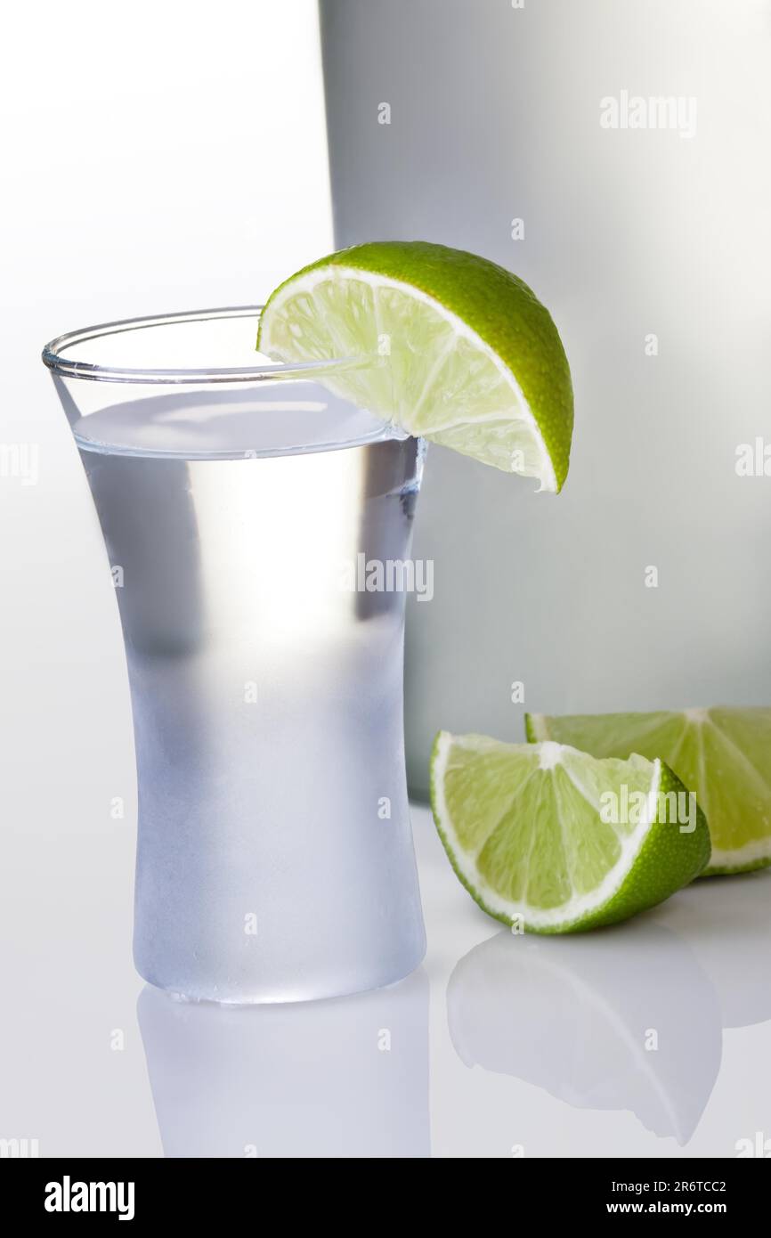 shot glass filled with clear cold alcohol Stock Photo - Alamy