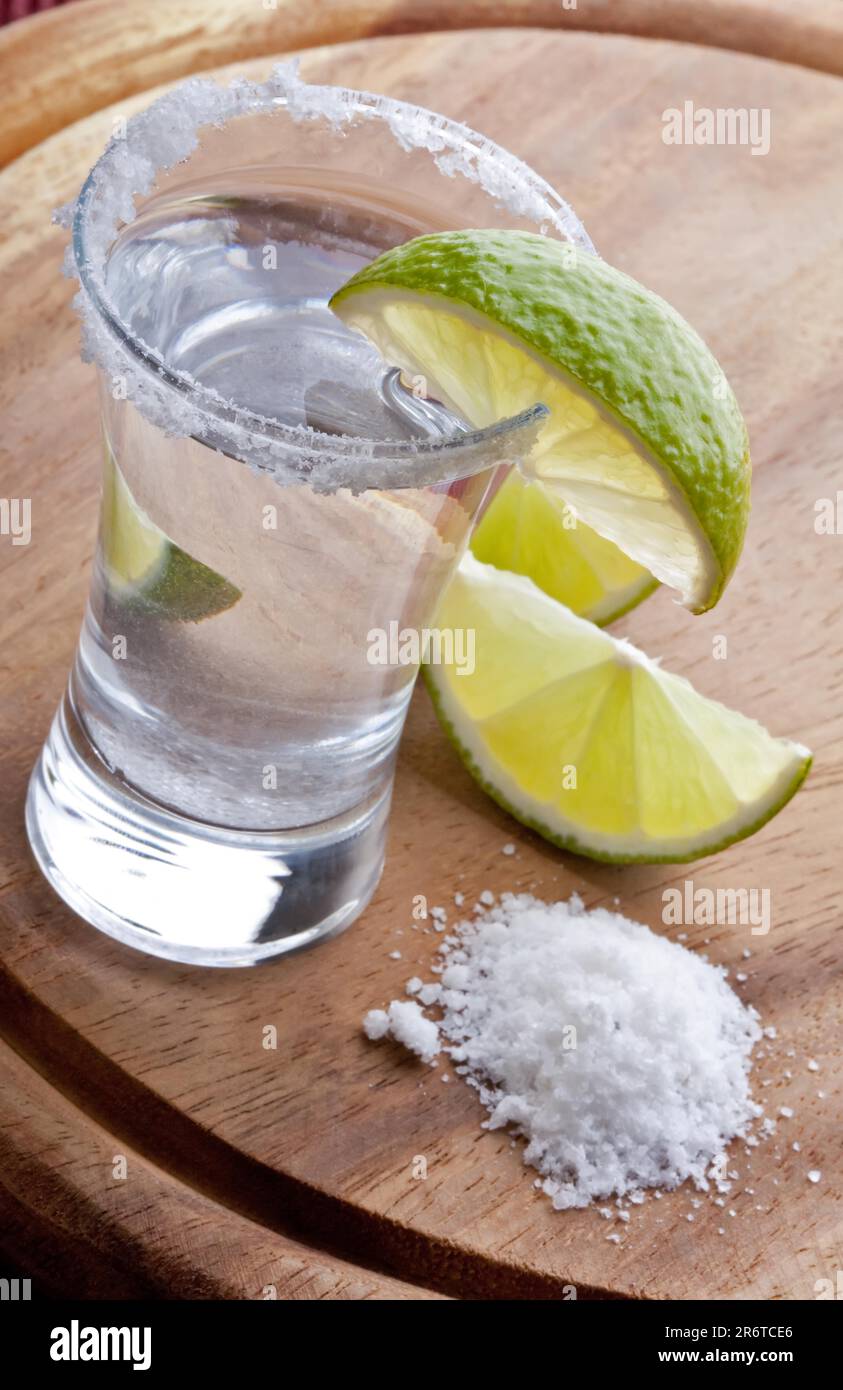 shot glass filled with clear cold alcohol Stock Photo - Alamy