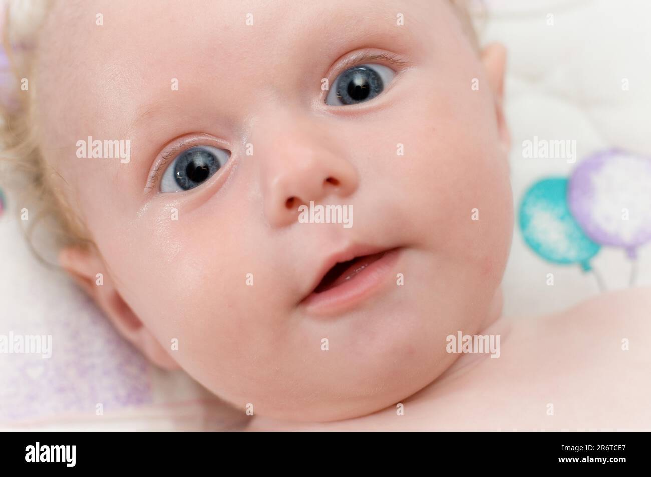Close up of a baby face with big eyes Stock Photo - Alamy