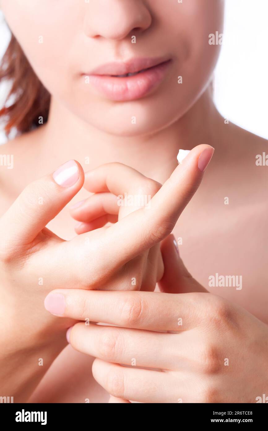 Lotion on the women hand. Isolated on white background Stock Photo - Alamy