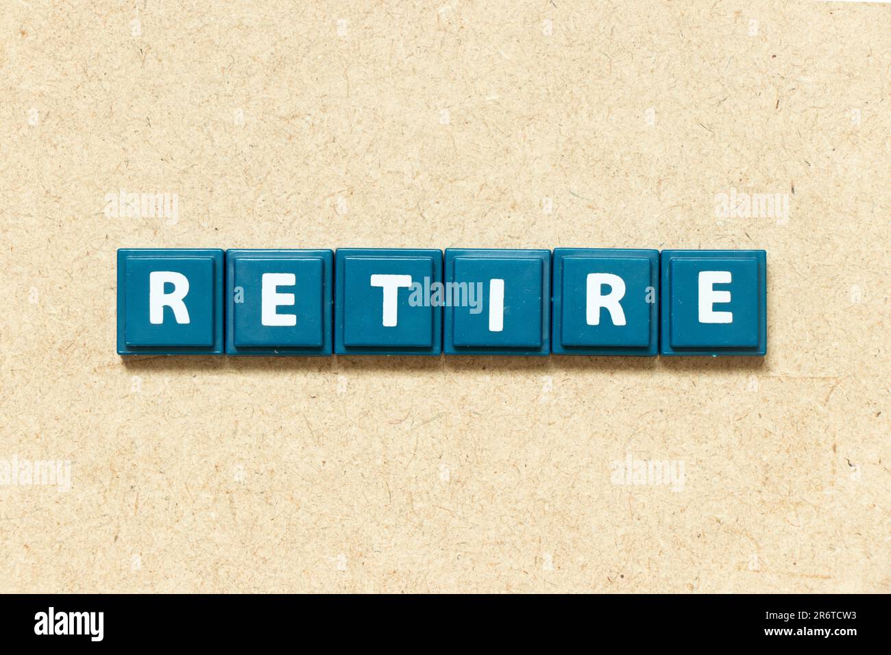 Tile alphabet letter in word retire on wood background Stock Photo - Alamy