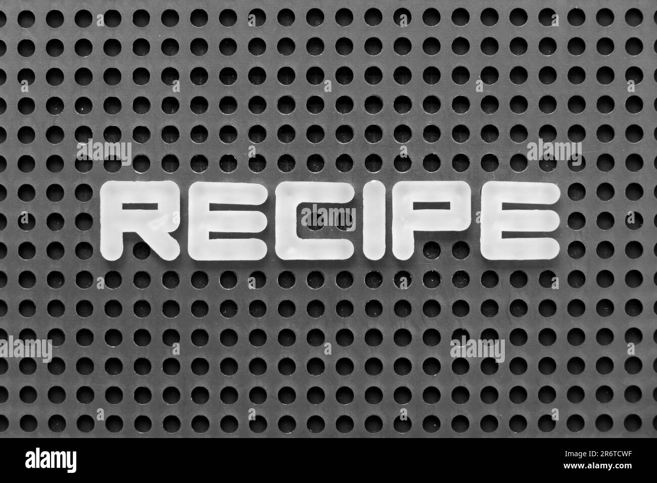 White alphabet letter in word recipe on black pegboard background Stock ...