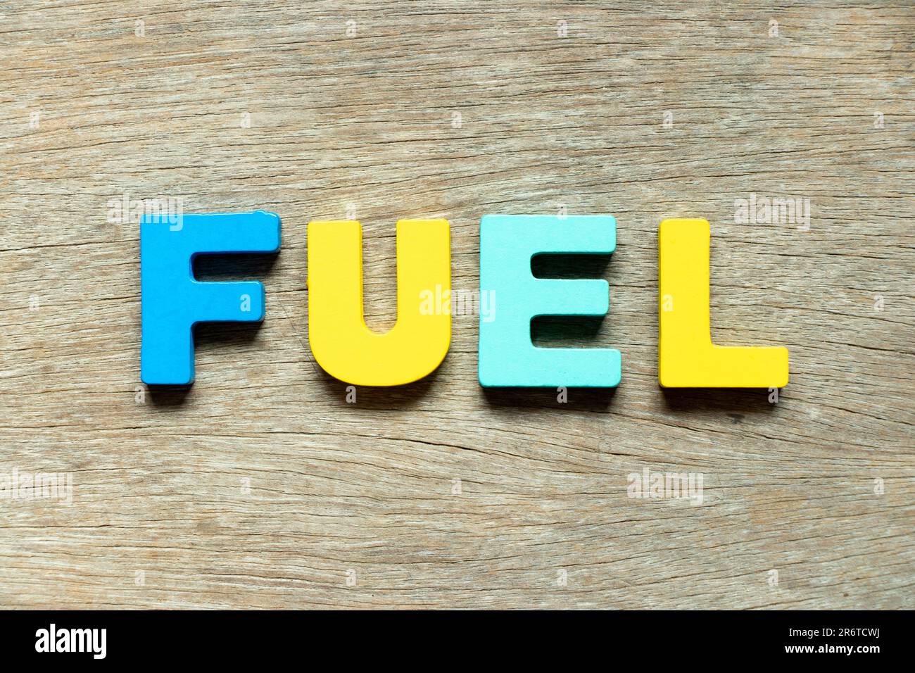 Color alphabet letter in word fuel on wood background Stock Photo - Alamy