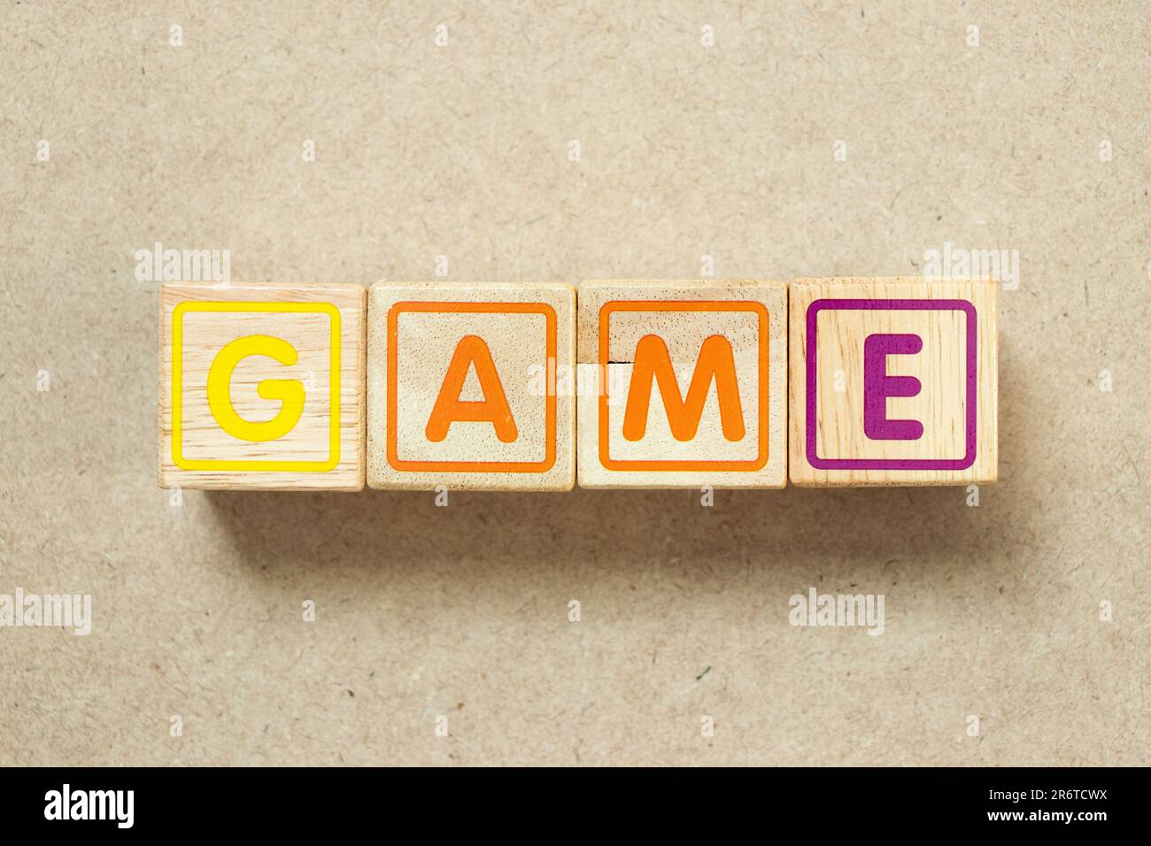 Wooden alphabet letter block in word game on wood background Stock ...