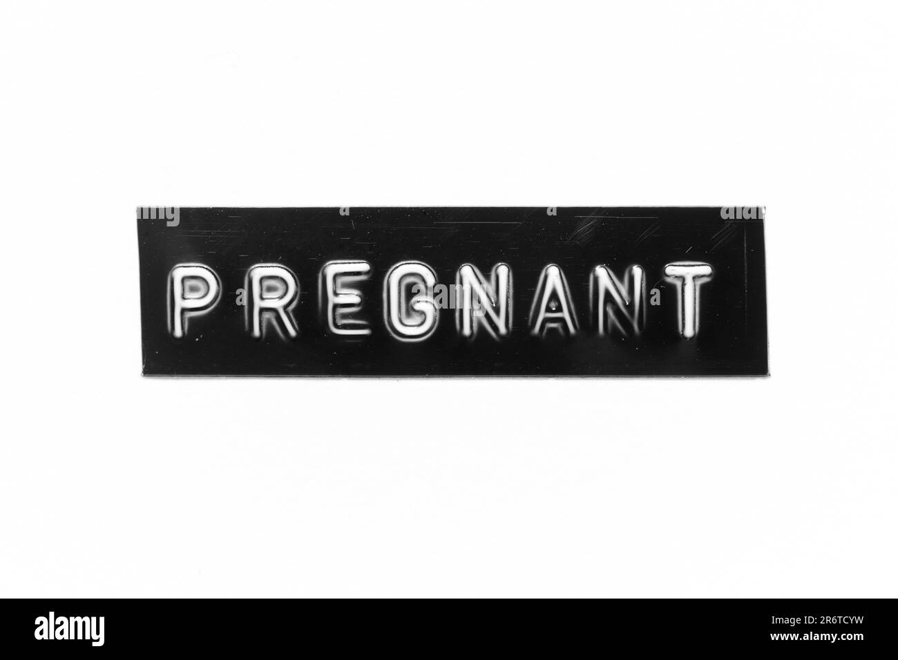Black color banner that have embossed letter with word pregnant on ...