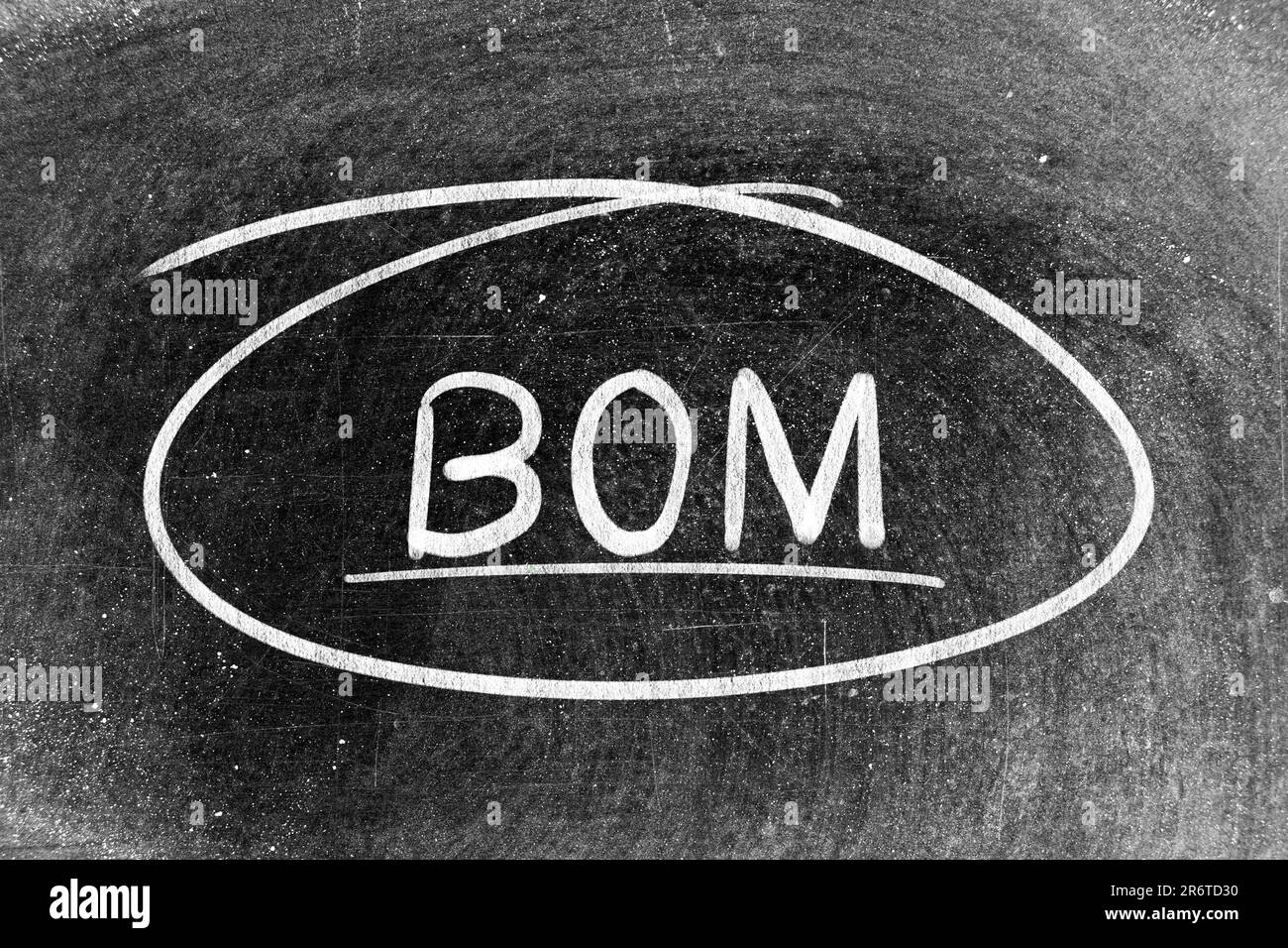 White chalk hand writing in word BOM (abbreviation of bill of materials ...