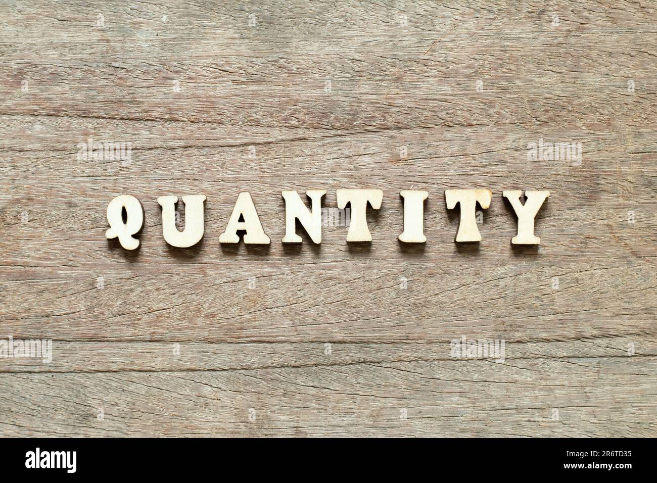 Alphabet letter block in word quantity on wood background Stock Photo ...