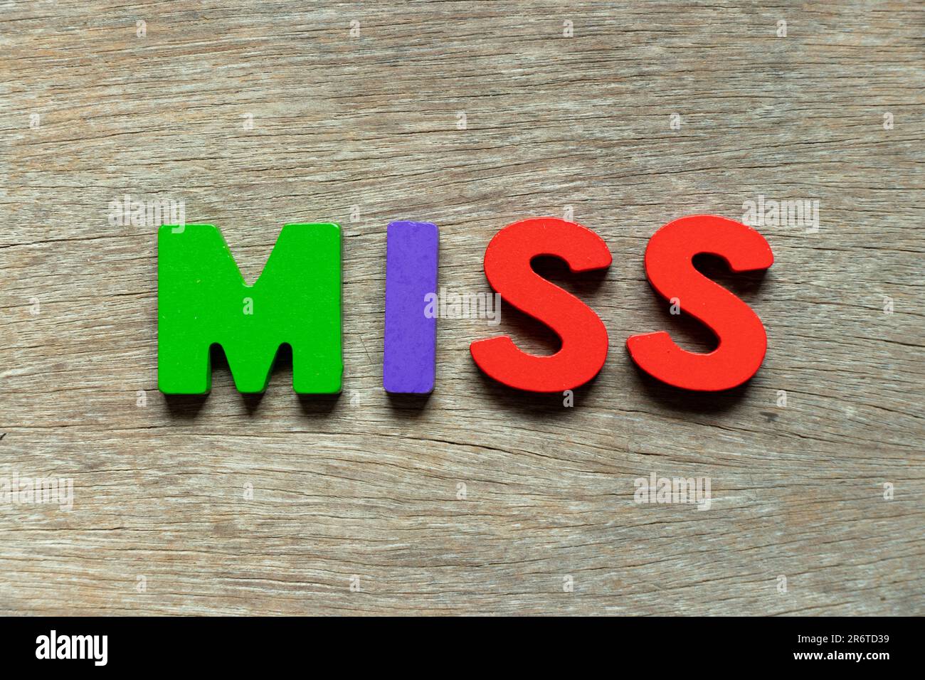 Color alphabet letter in word miss on wood background Stock Photo - Alamy