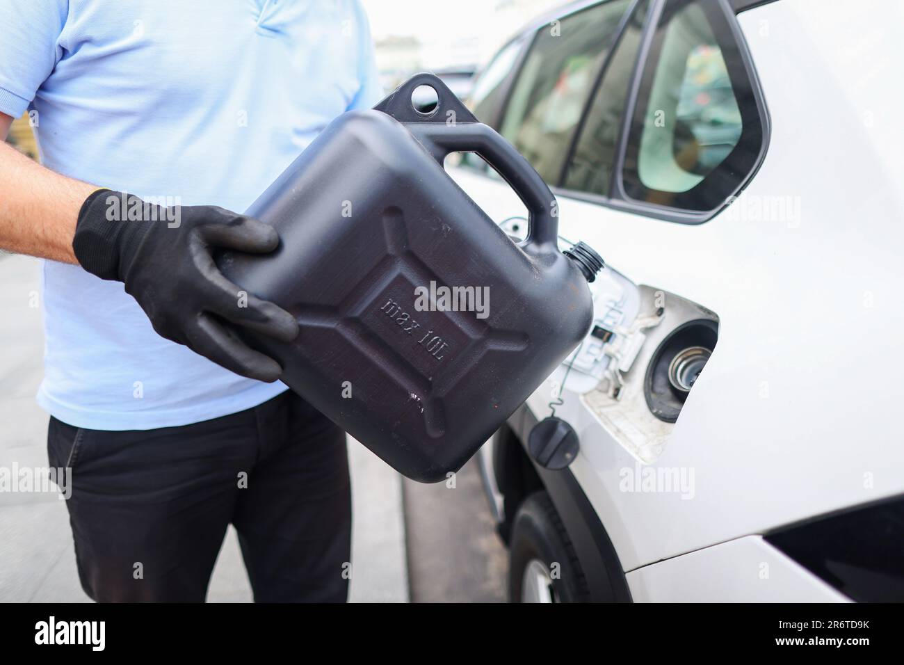 Self service Fuel pump from the canister Stock Photo - Alamy