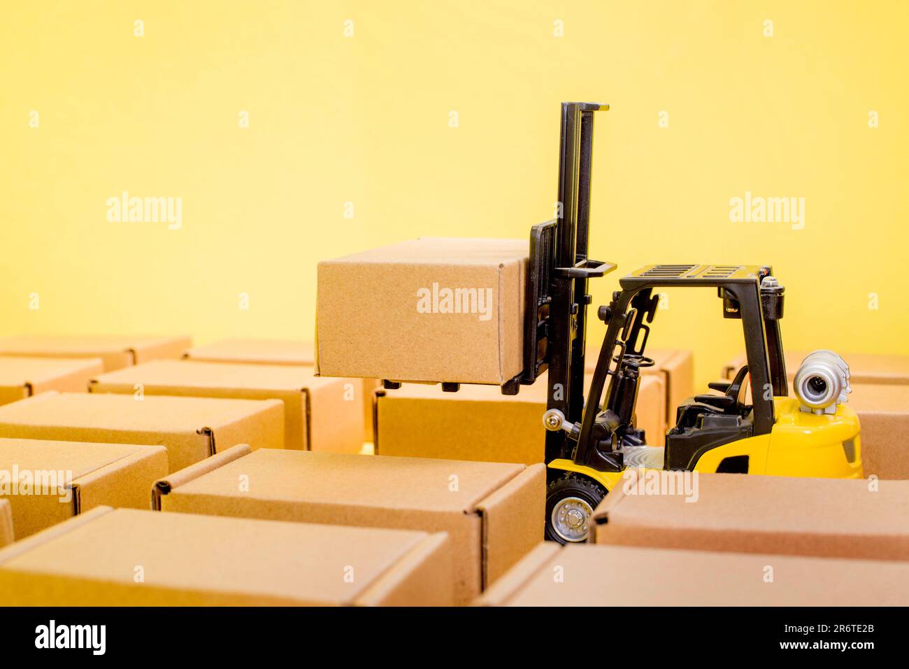 Warehouse with cardboard kraft boxes and a forklift truck. Cargo ...
