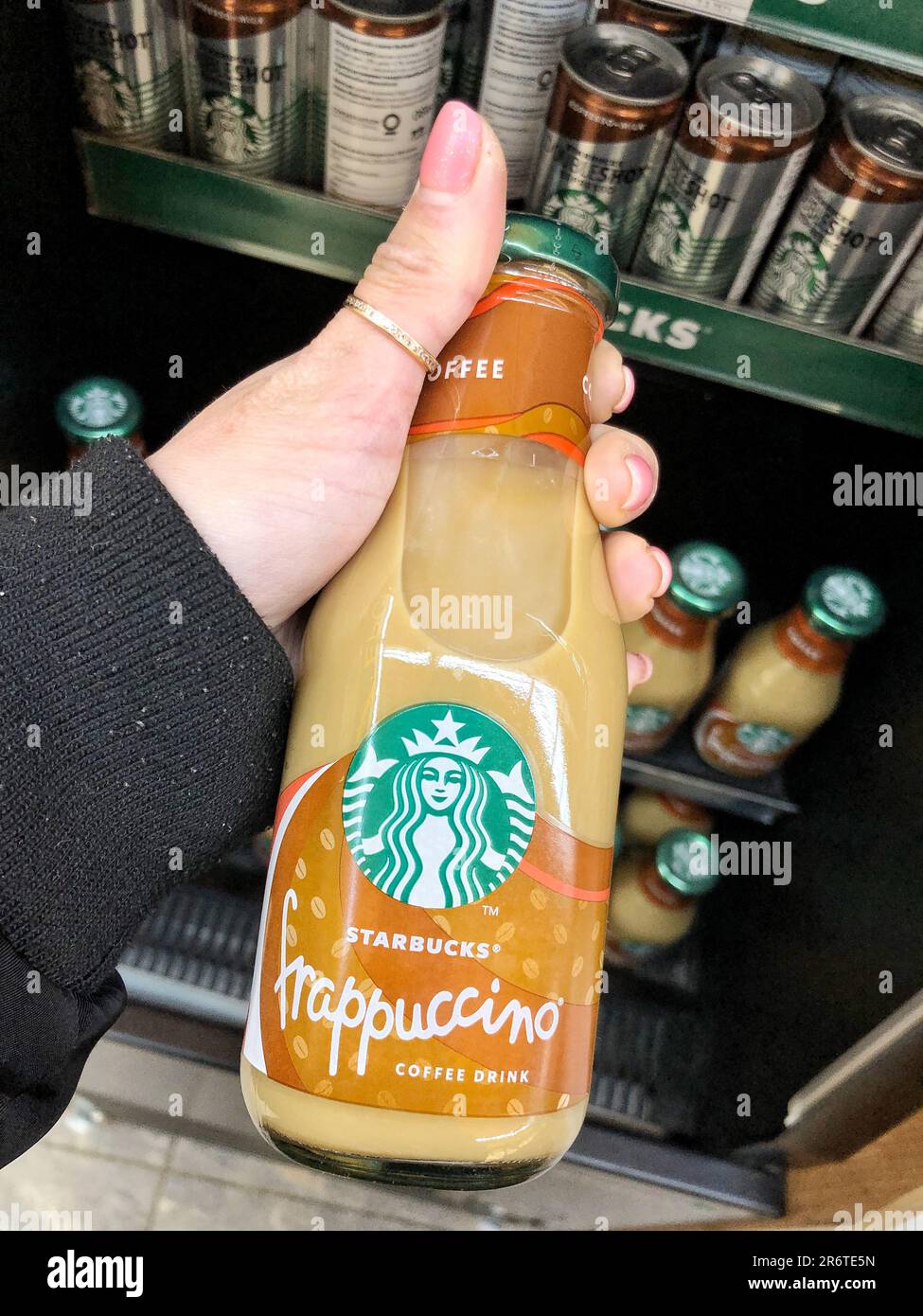 02.05.2023 Ukraine, Kharkiv, Starbucks cold drinks fridge. Glass bottle ...
