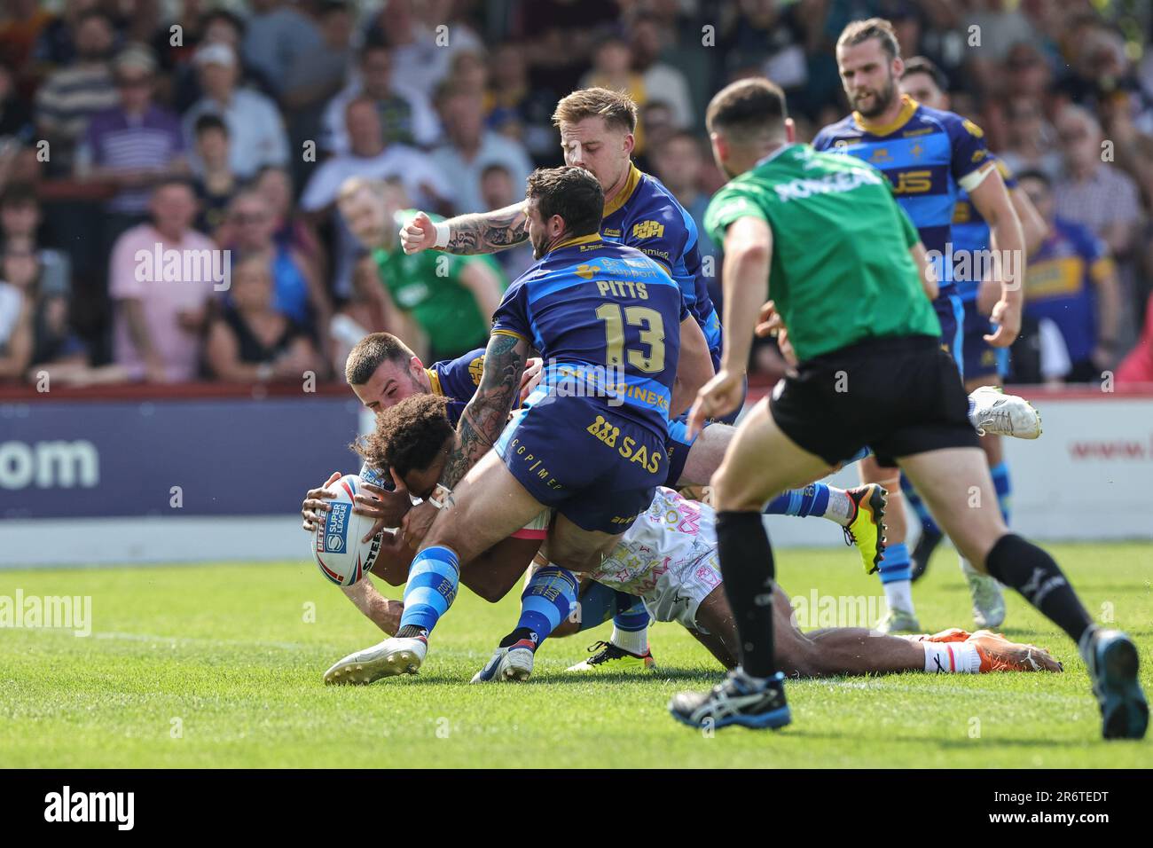 Leon Ruan #31 of Leeds Rhinos goes over for a try on his debut during ...