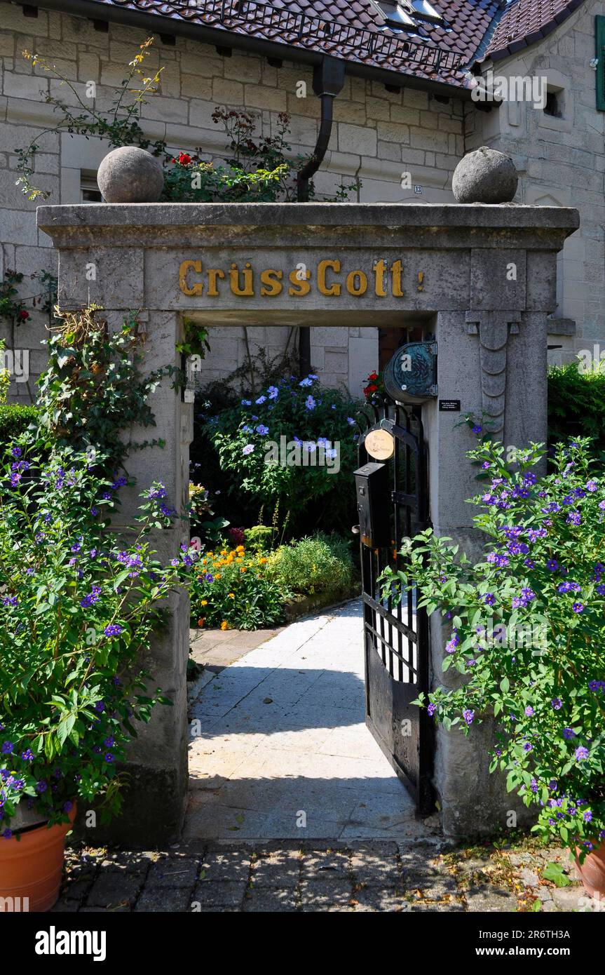 Entrance gate with Gruess Gott inscription Stock Photo - Alamy