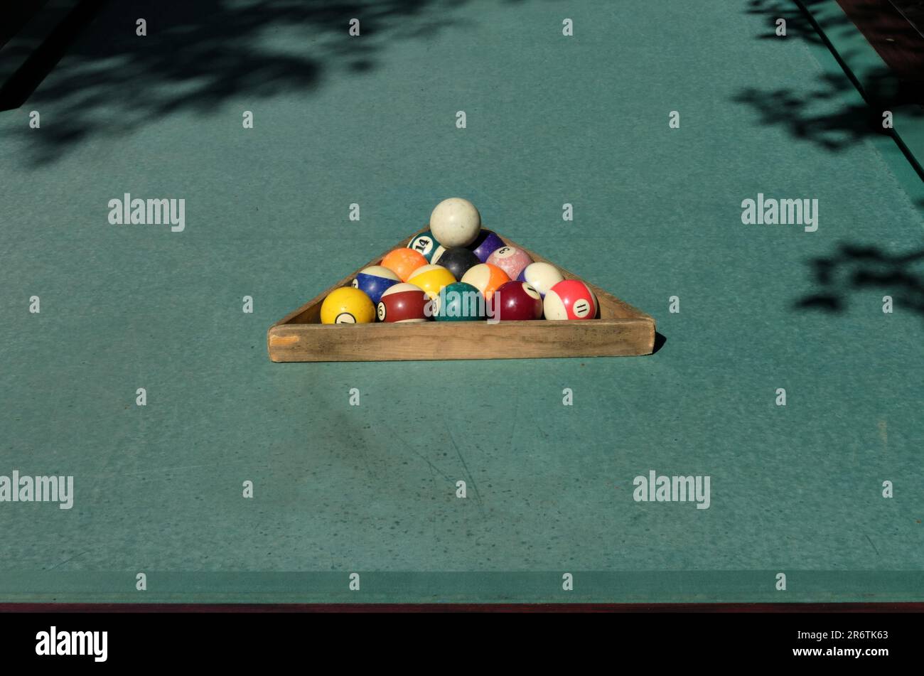 billiard balls on the pool table outdoors Stock Photo - Alamy