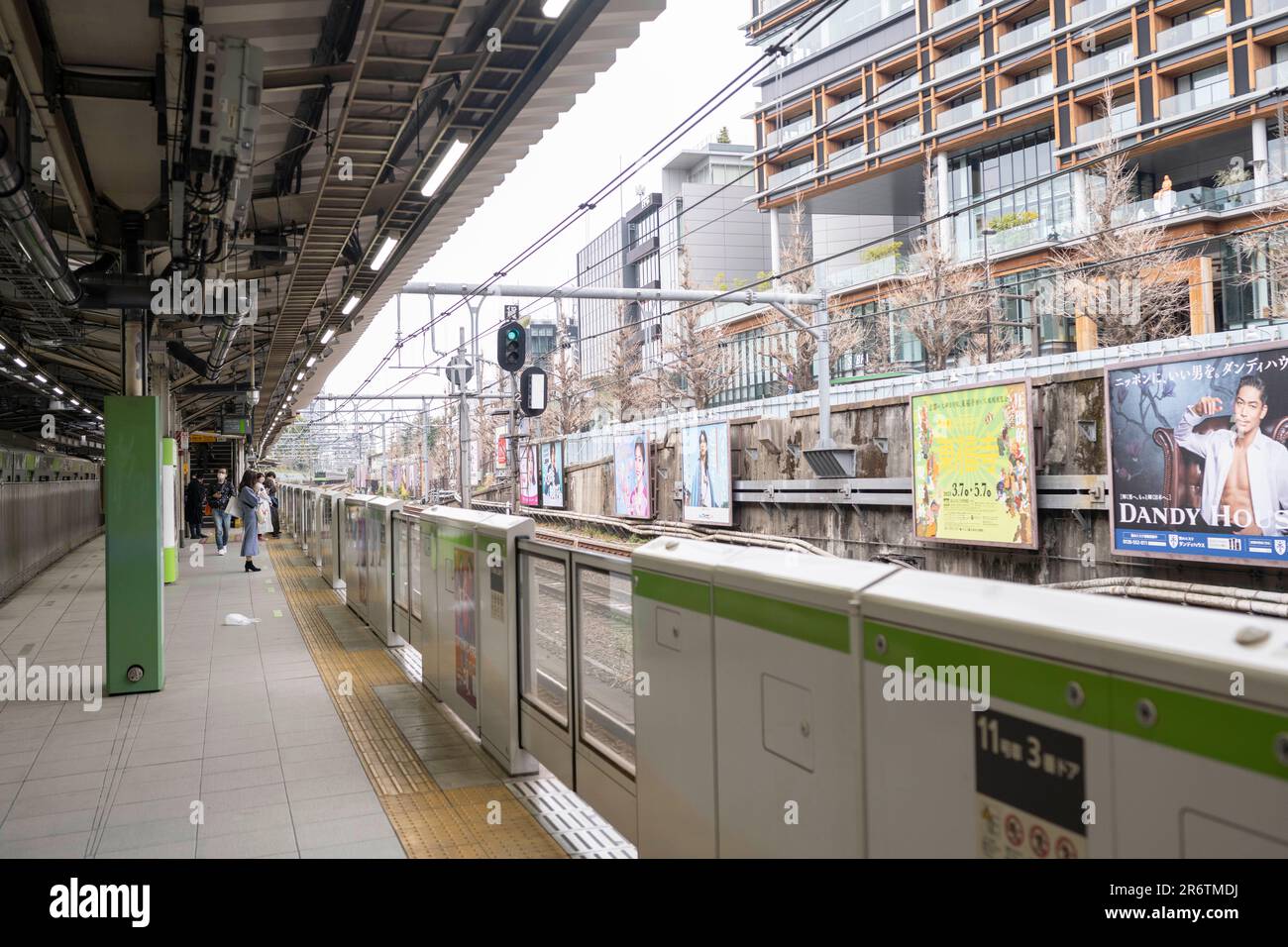 Tokyo, Japan. 21st Mar, 2023. Commuters and passengers await the ...
