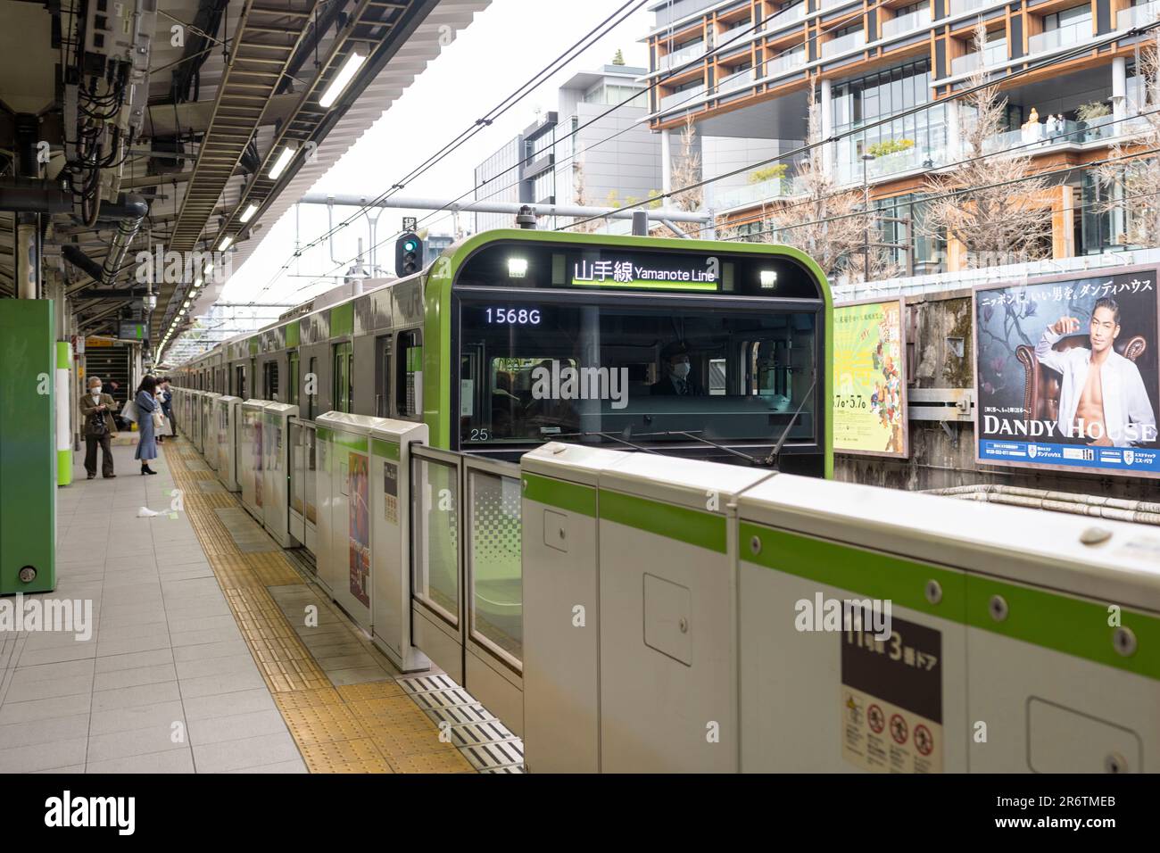 Tokyo, Japan. 21st Mar, 2023. Commuters and passengers await the ...