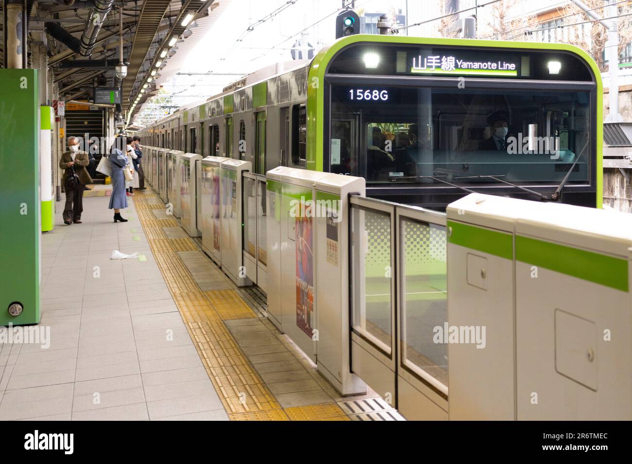 Tokyo, Japan. 21st Mar, 2023. Commuters and passengers await the ...