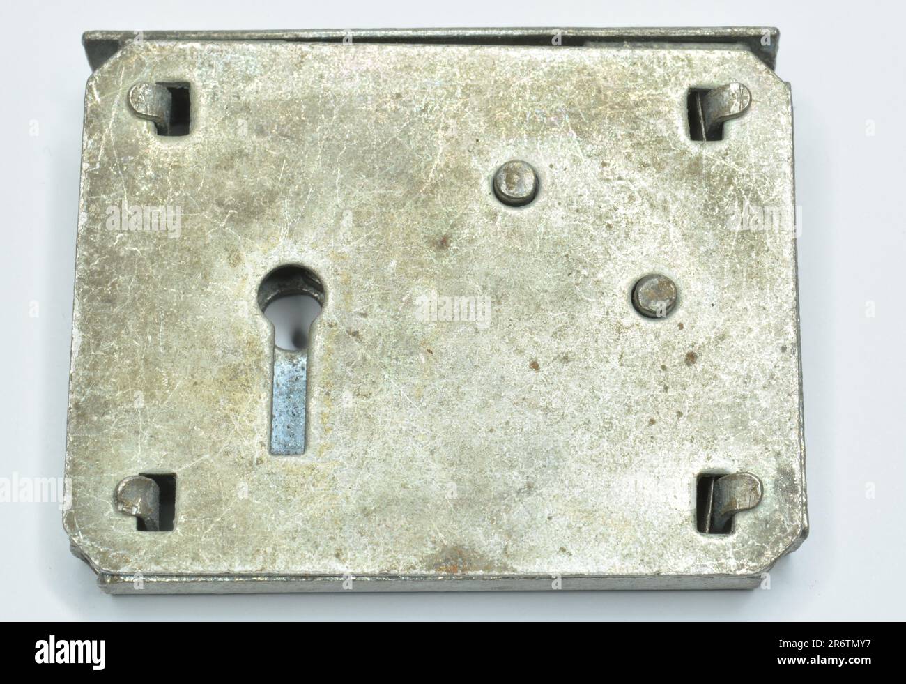 Vintage metal door lock mechanism on gray background Stock Photo - Alamy